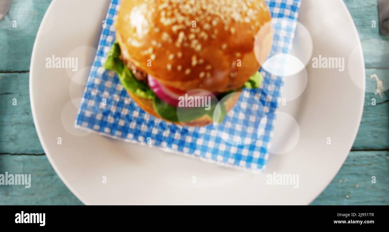 Image of bokeh over burger on plate Stock Photo - Alamy
