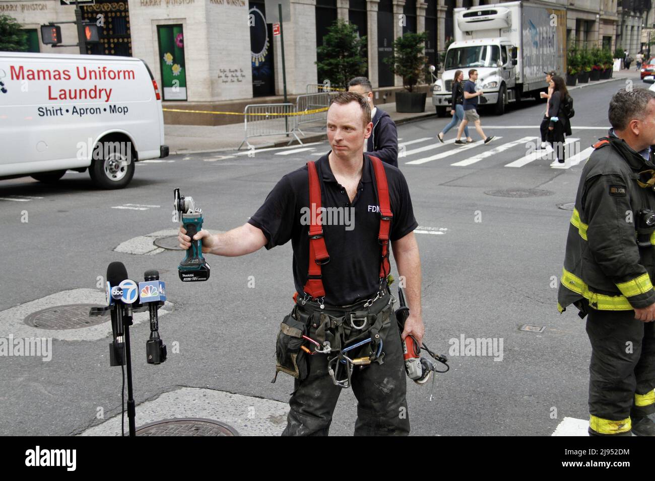New York, USA: May 20, 2022, (NEW) Two workers saved from a falling ...