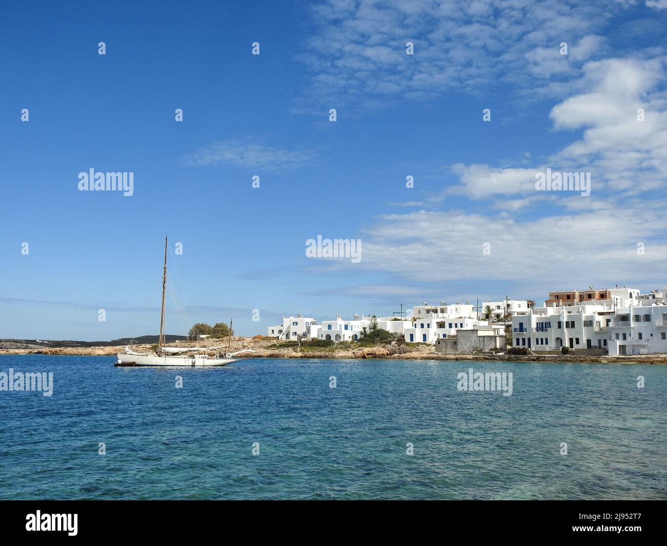 Village of Naousa, in Paros, with sailboat on the left Stock Photo - Alamy