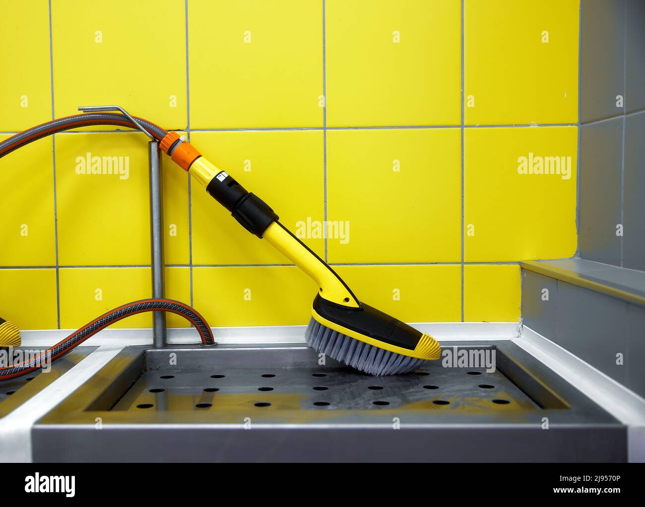 A shoe-washing brush. Washing for sports shoes in the locker room of ...