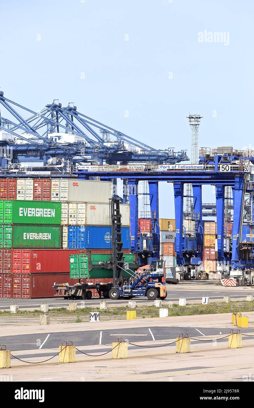 Container handler moving/loading containers in dockside container yard ...