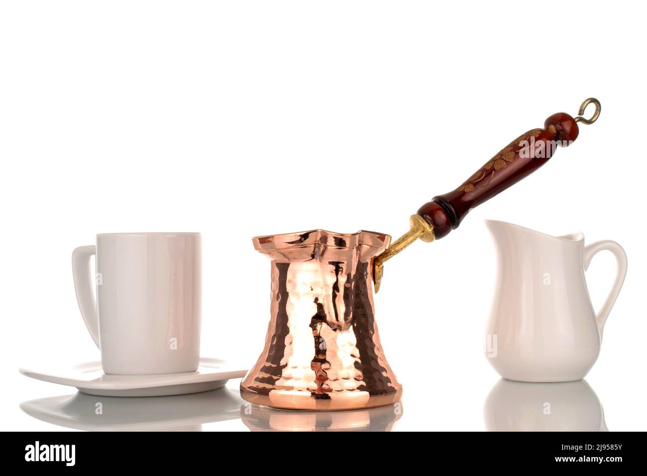 One Turkish Cezve copper coffee pot with white ceramic cup and milk jug ...