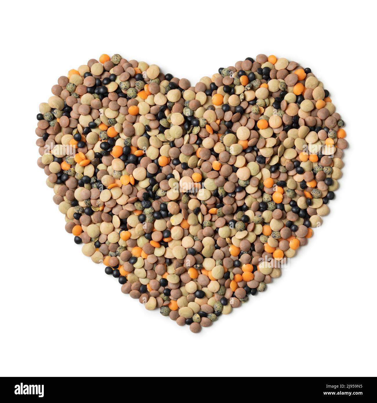 Mixture of different type lentils in heart shape isolated on white ...