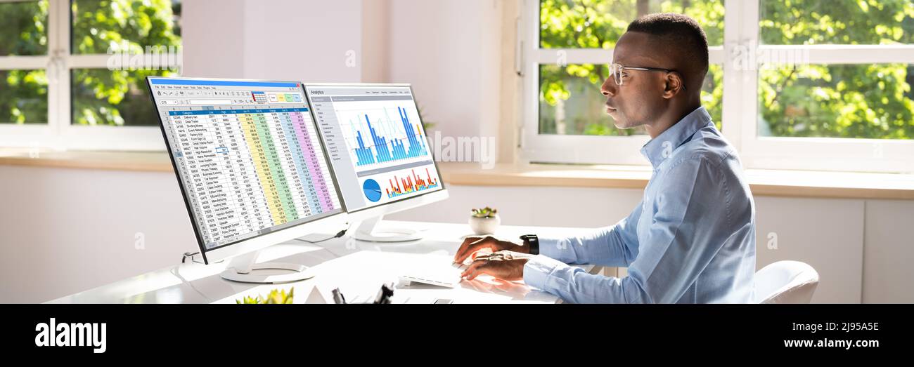 Businessperson Calculating E-Invoice Online On Computer At Office Stock ...