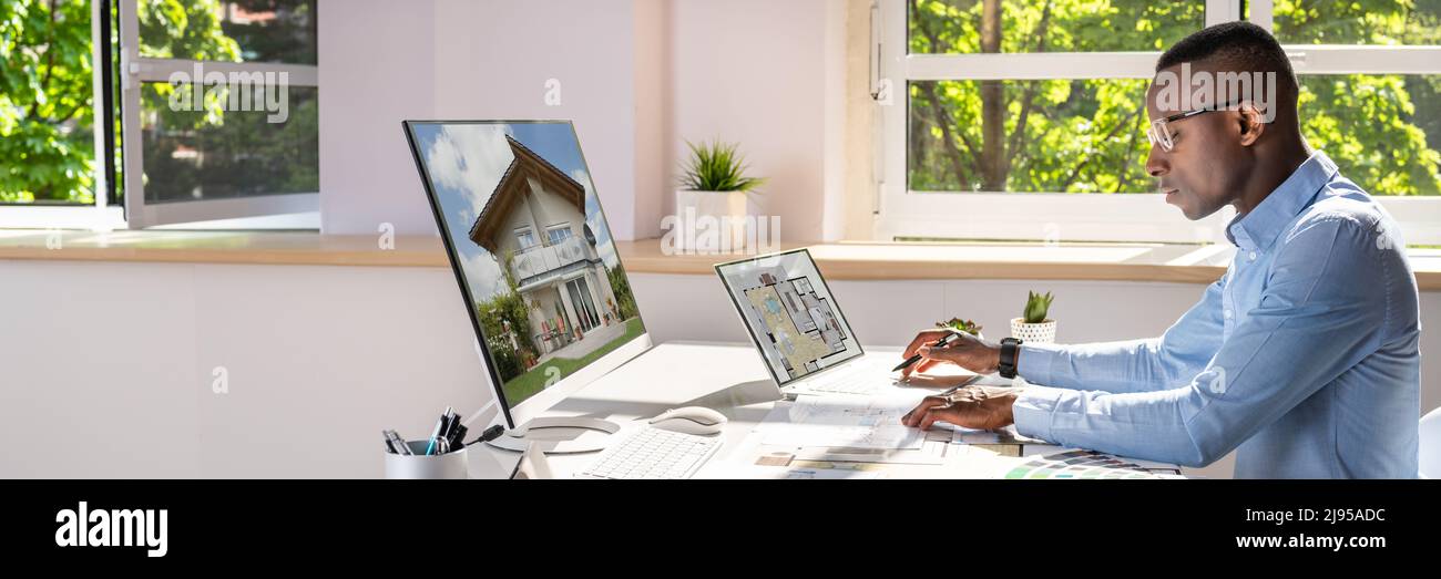 Side View Of Real Estate Designer Working On Computer In Office Stock ...