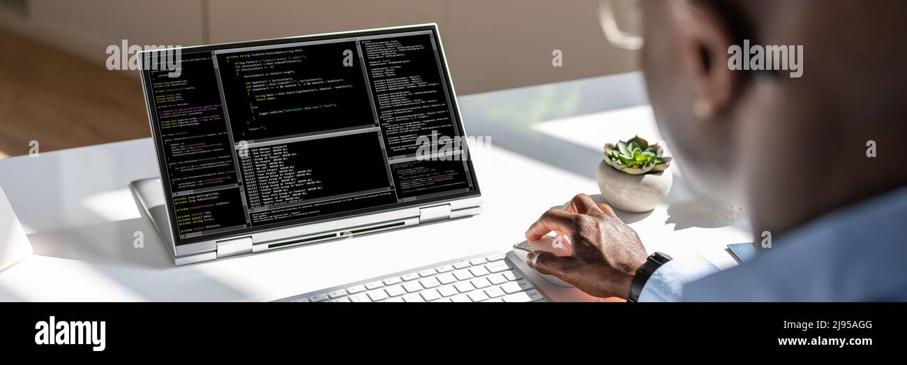 African American Coder Using Computer At Desk. Web Developer Stock Photo - Alamy