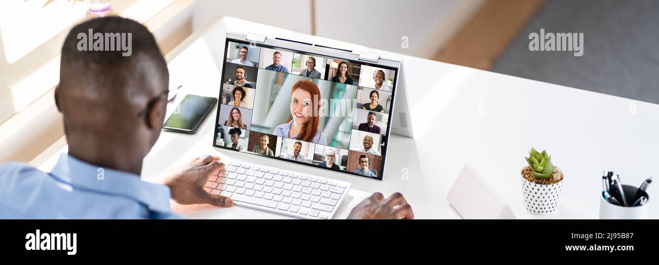 Businessman Video Conferencing With His Colleague On Hybrid Laptop On ...