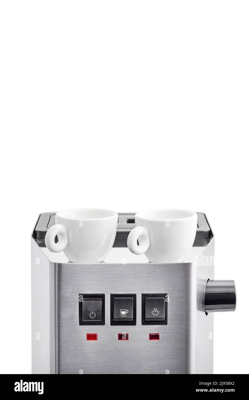 2 ceramic demitasse white espresso cups stand on warming top of a ...