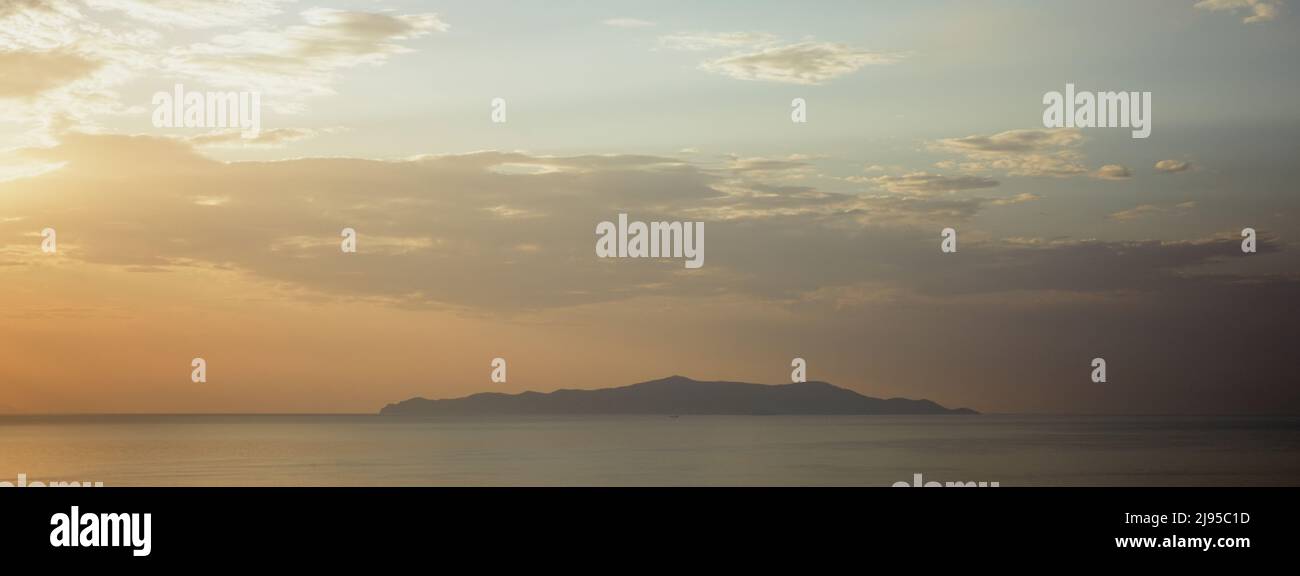 Sunset across Kini bay looking east towards Kea Stock Photo - Alamy
