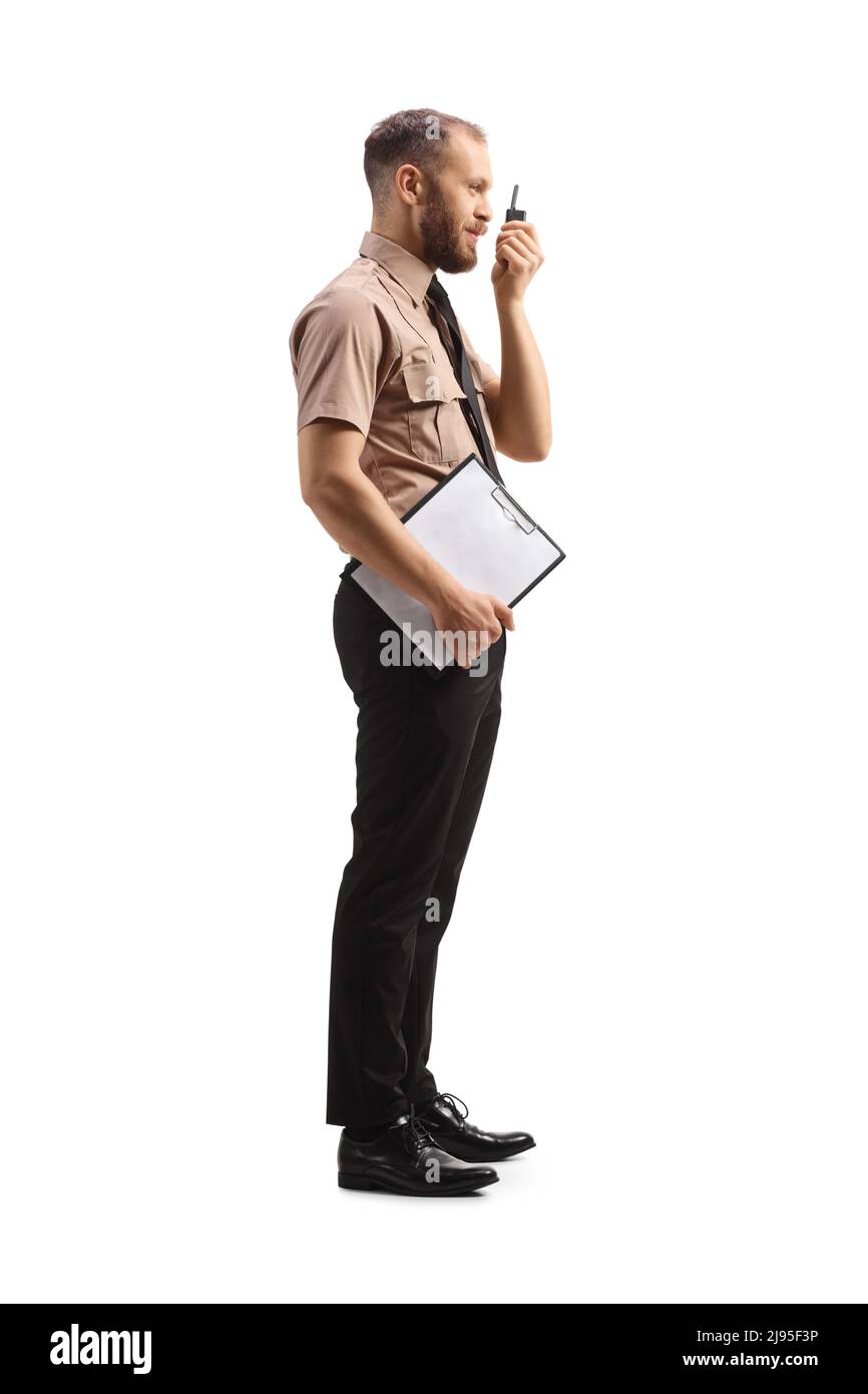Full length profile shot of a security officer holding a clipboard and ...