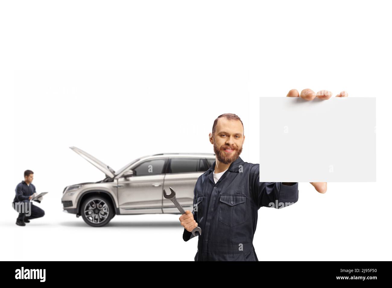 Car service and mechanic showing a blank cardboard isolated on white ...