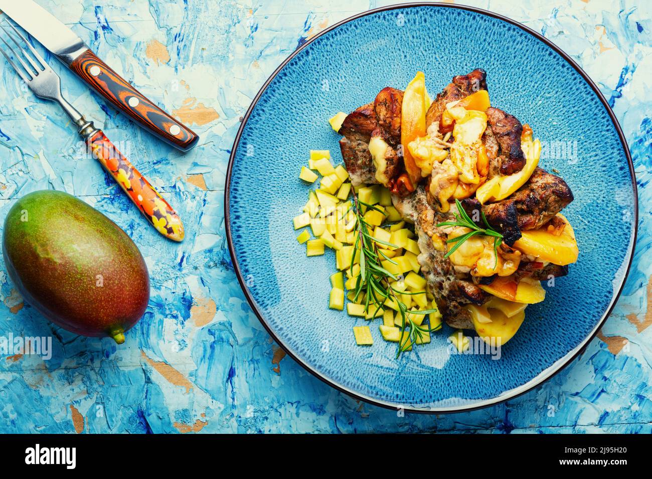 Delicious grilled meat with mango and cheese Stock Photo - Alamy