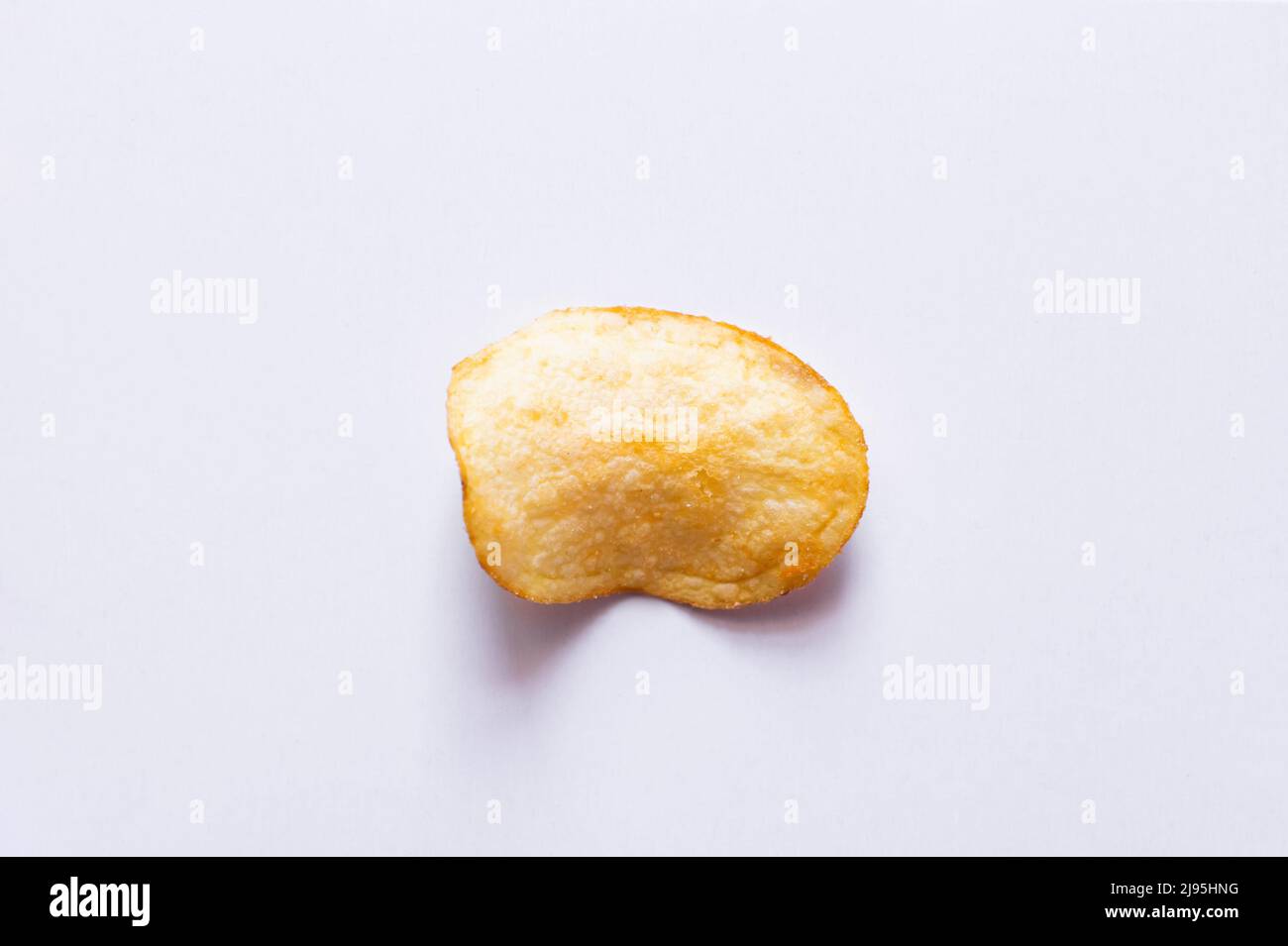 top view of single fried and salty potato chip on white Stock Photo - Alamy