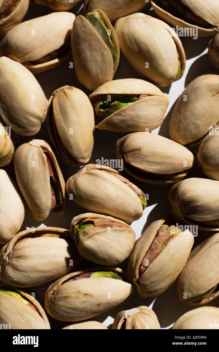 close up view of cracked green and salty pistachios Stock Photo - Alamy