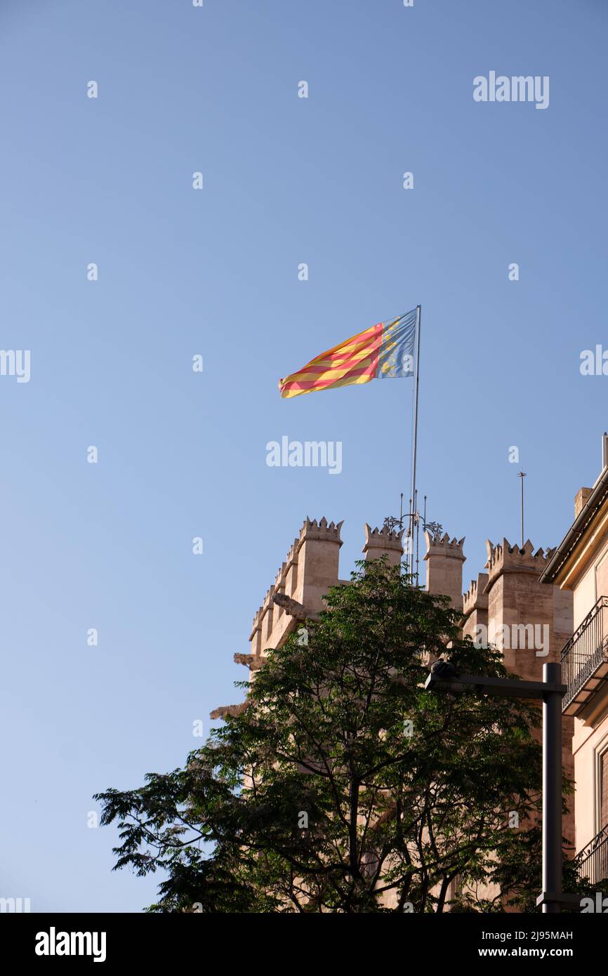 Close-up of the tower of La Lonja de la Seda with a flying Valencian ...