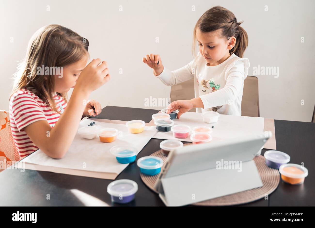 Little girls sculpt figurines crafts from air plasticine, modeling ...