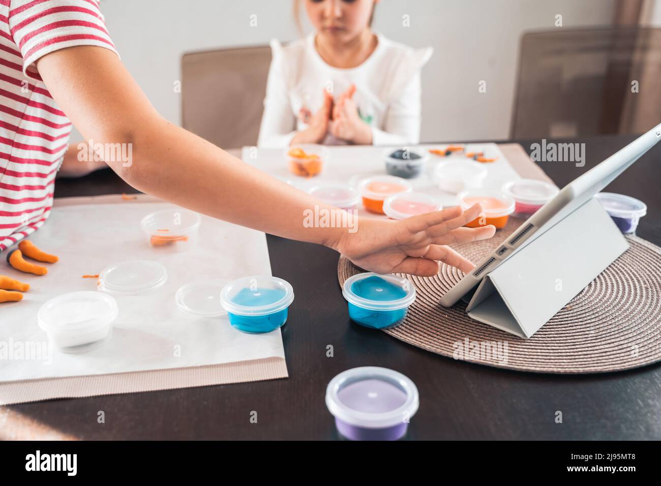 Little girls sculpt figurines crafts from air plasticine, modeling ...