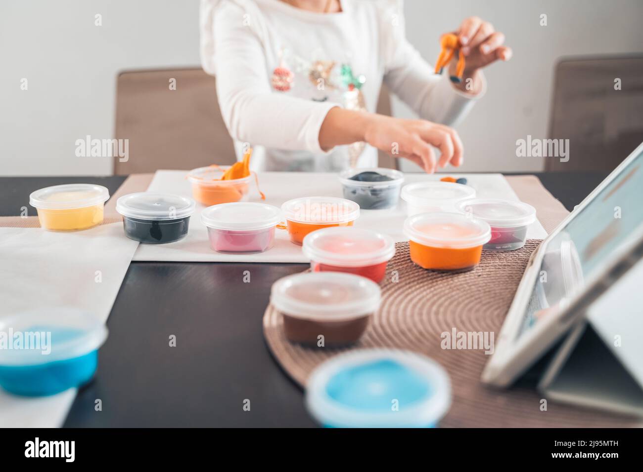 Little girls sculpt figurines crafts from air plasticine, modeling ...