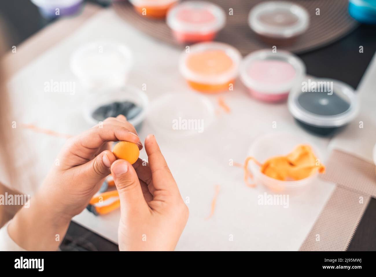 Little girls sculpt figurines crafts from air plasticine, modeling ...