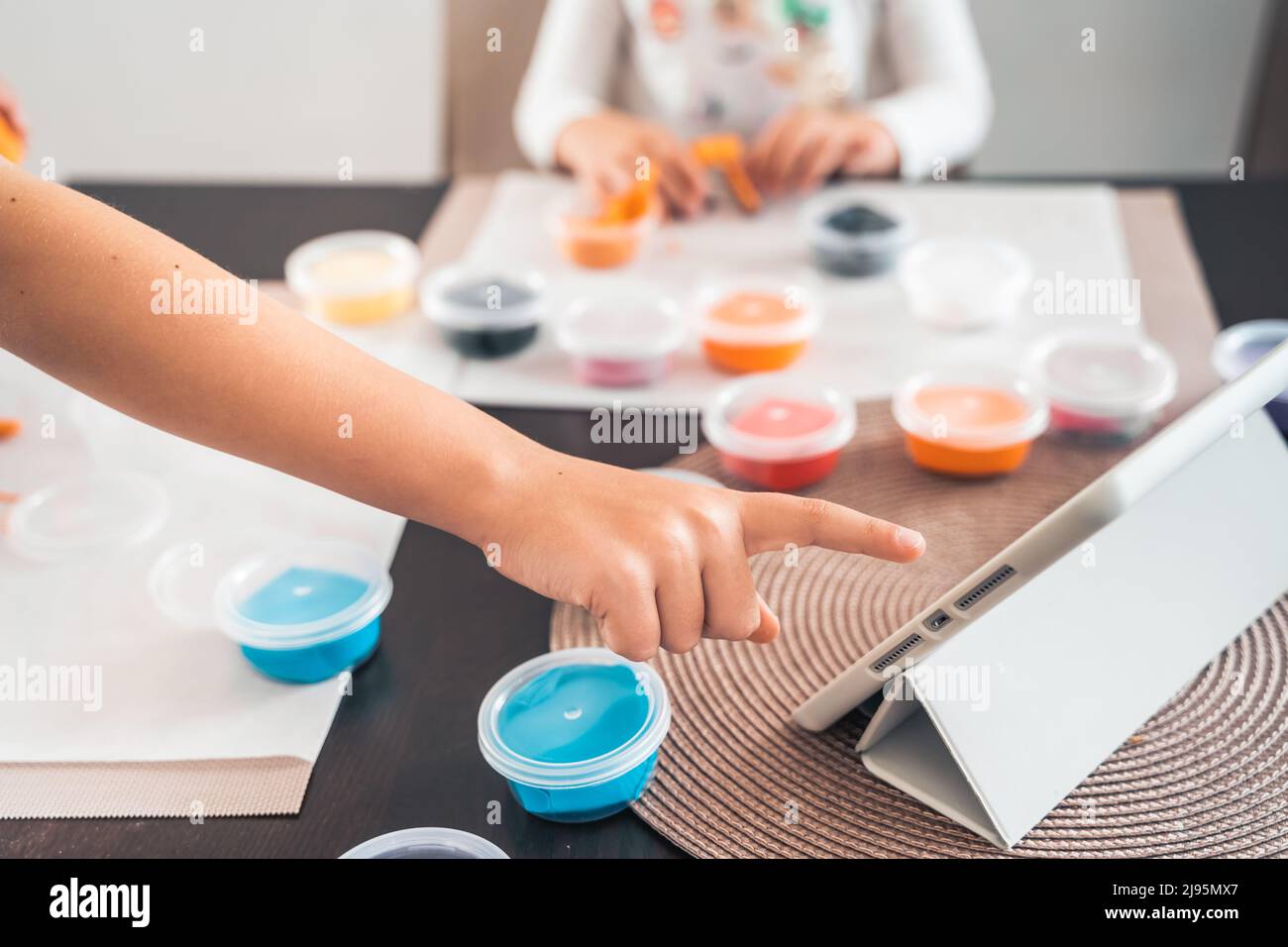 Little girls sculpt figurines crafts from air plasticine, modeling ...