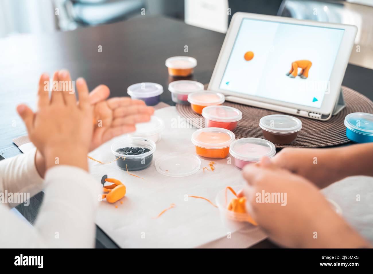 Little girls sculpt figurines crafts from air plasticine, modeling ...