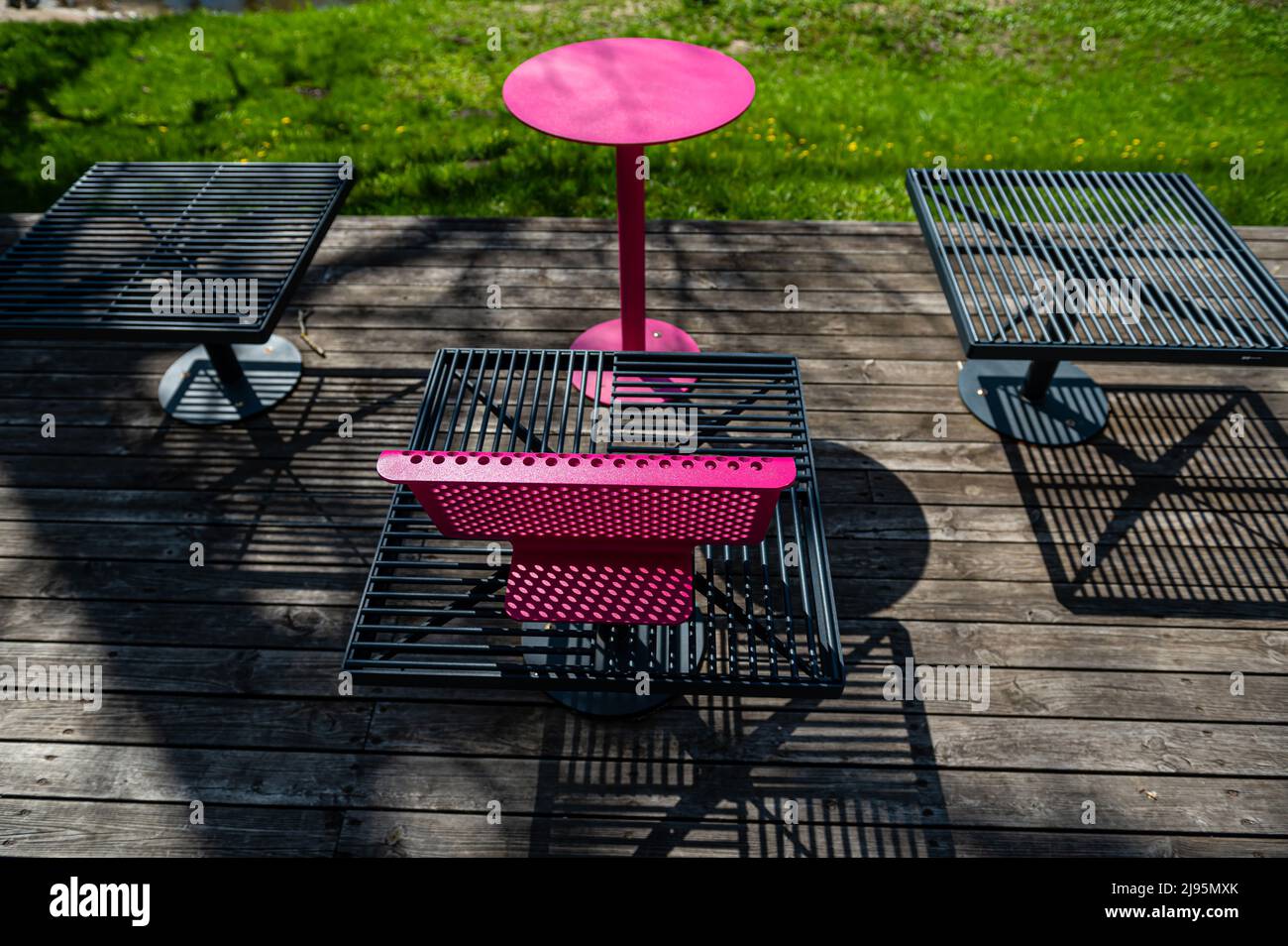 colorful metal benches and tables on the terrace on a sunny day Stock ...