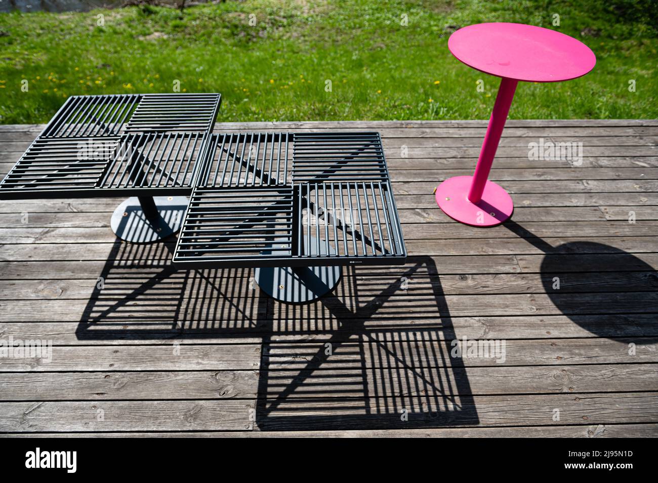 colorful metal benches and tables on the terrace on a sunny day Stock ...