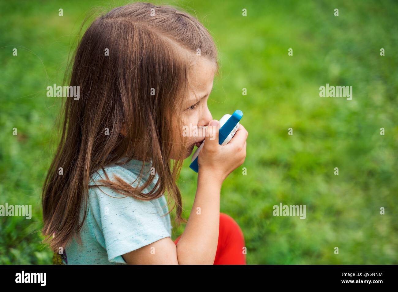 Small girl,kid play in walkie-talkie.Walkie Talkies with channels.Game ...