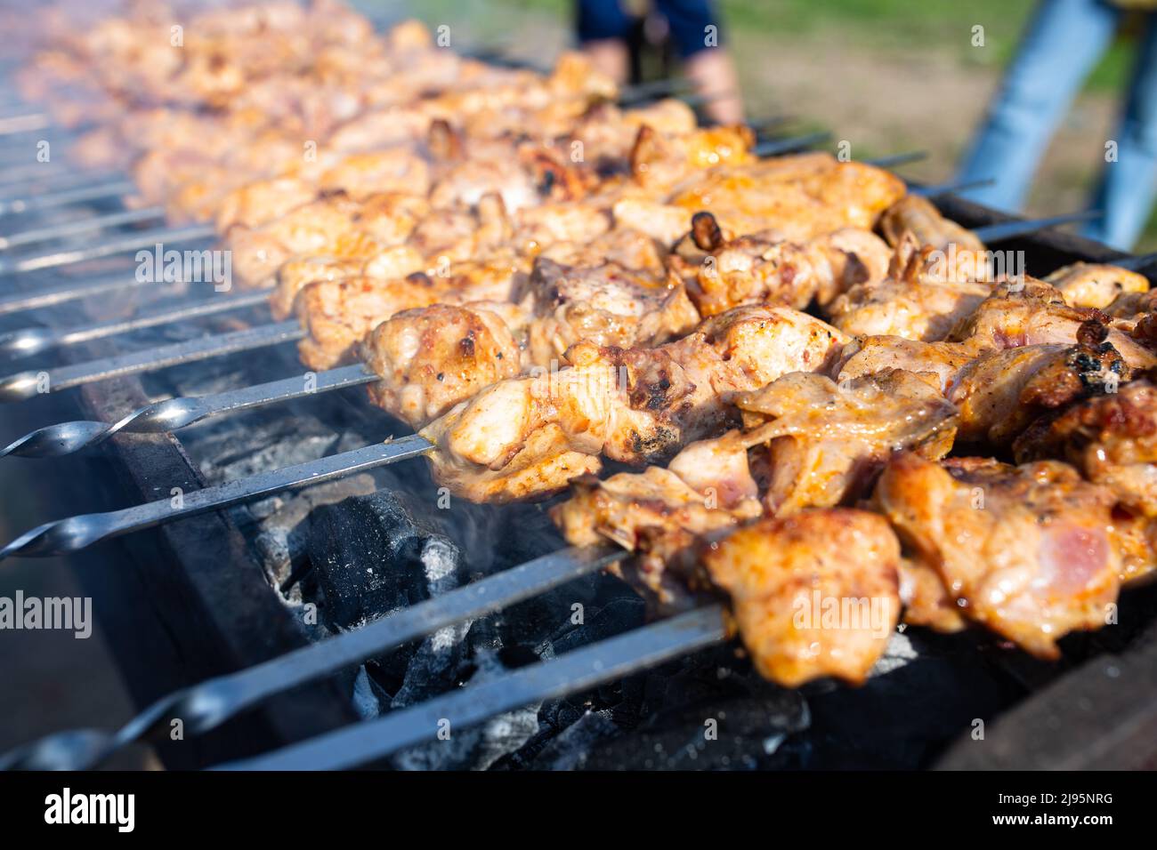 chicken shish kebab is grilled on the grill in nature Stock Photo - Alamy