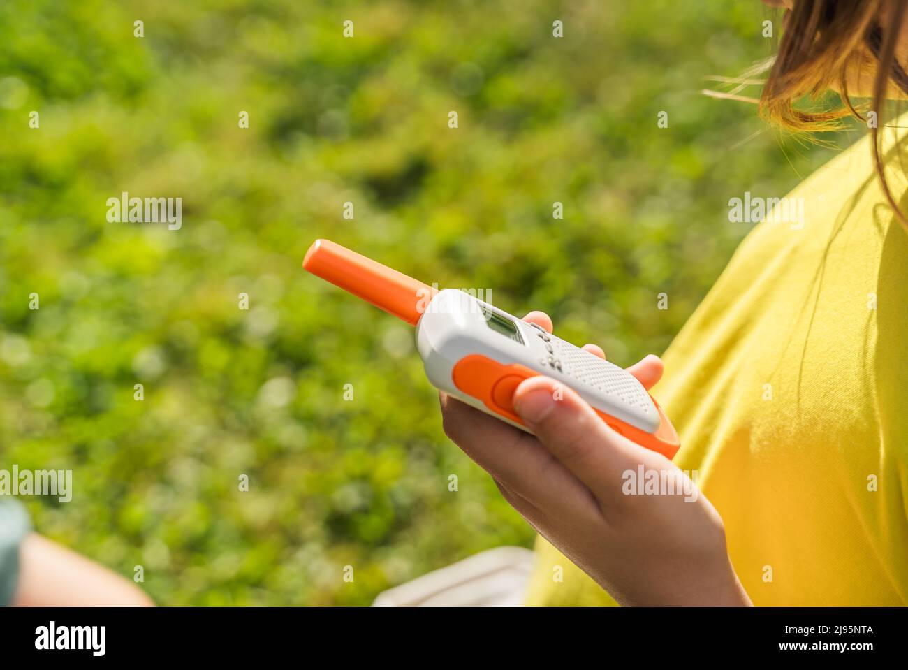 Small girl,kid play in walkie-talkie.Walkie Talkies with channels.Game ...
