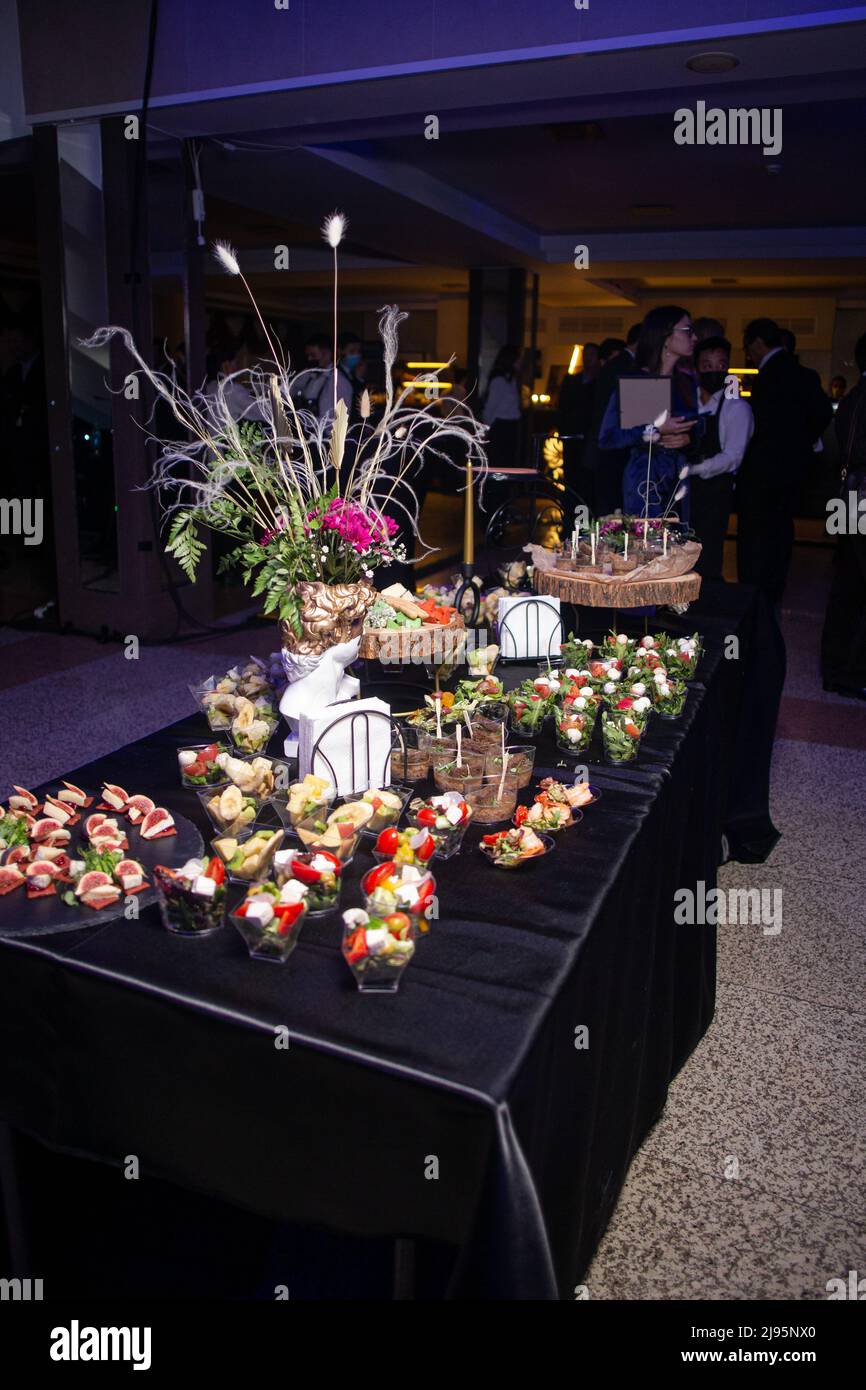 Snacks in plastic cups on the buffet at the event Stock Photo - Alamy