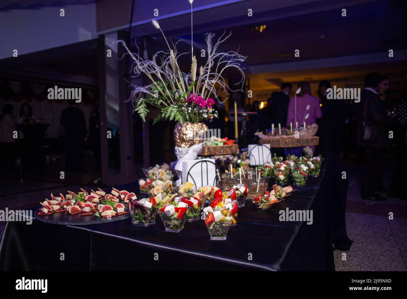Snacks in plastic cups on the buffet at the event Stock Photo - Alamy