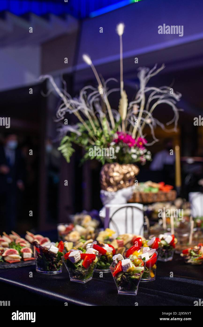 Snacks in plastic cups on the buffet at the event Stock Photo - Alamy