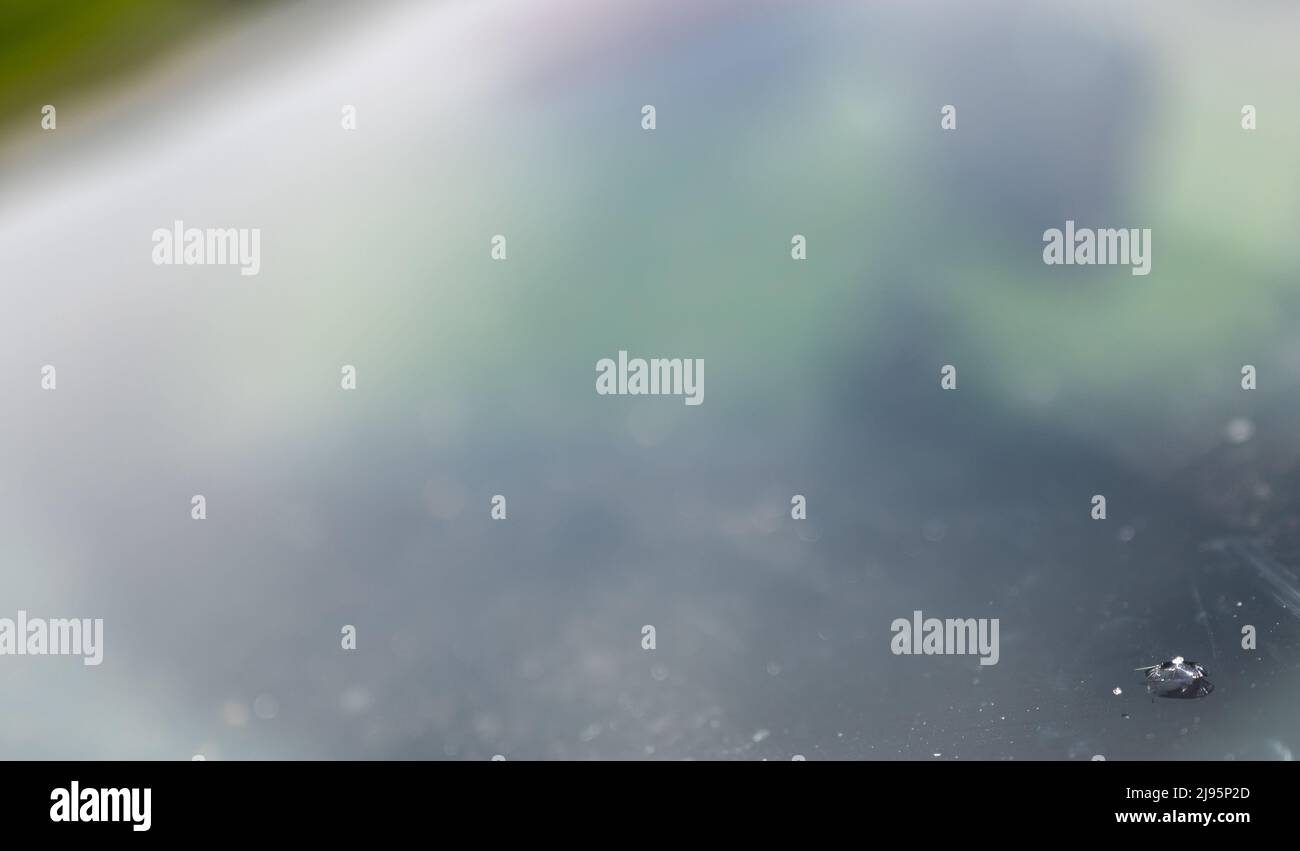 Chip in the glass windshield of a vehicle Stock Photo - Alamy