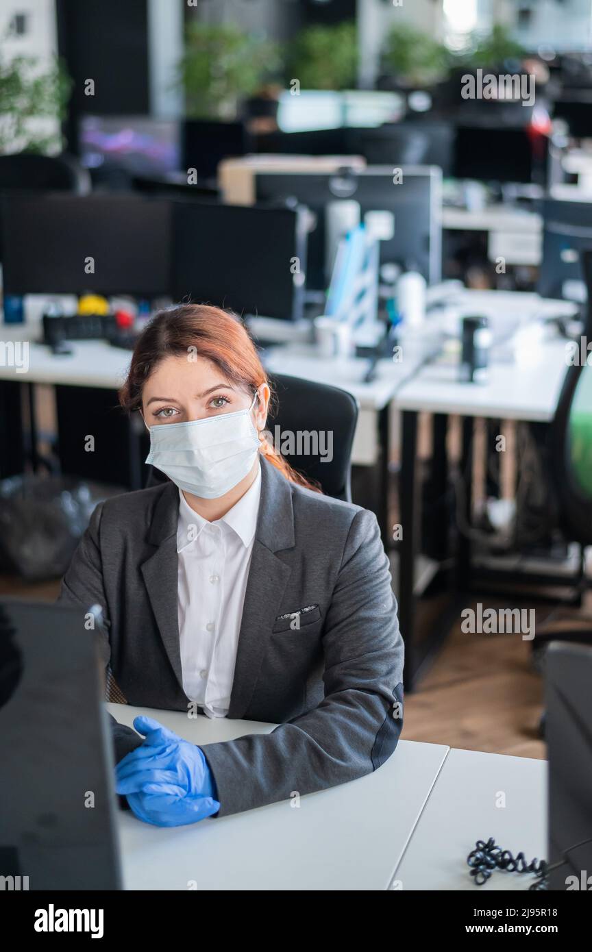 Female manager is sitting in a chair at the workplace. Business woman ...
