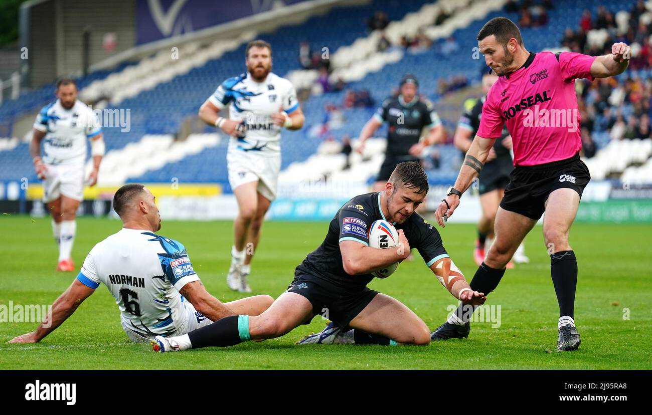Huddersfield Giant's Sam Hewitt dives in his sides first try during the ...