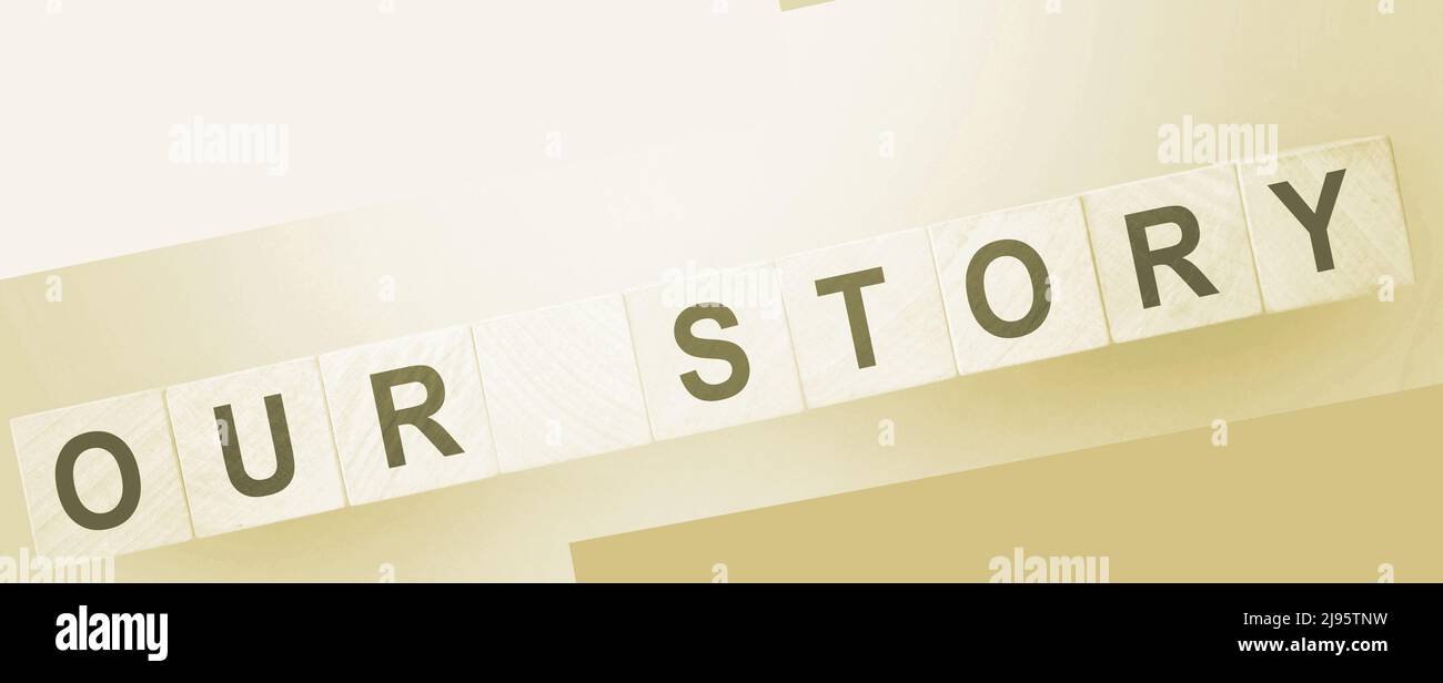 OUR STORY words on wooden cubic building block . Business with history ...