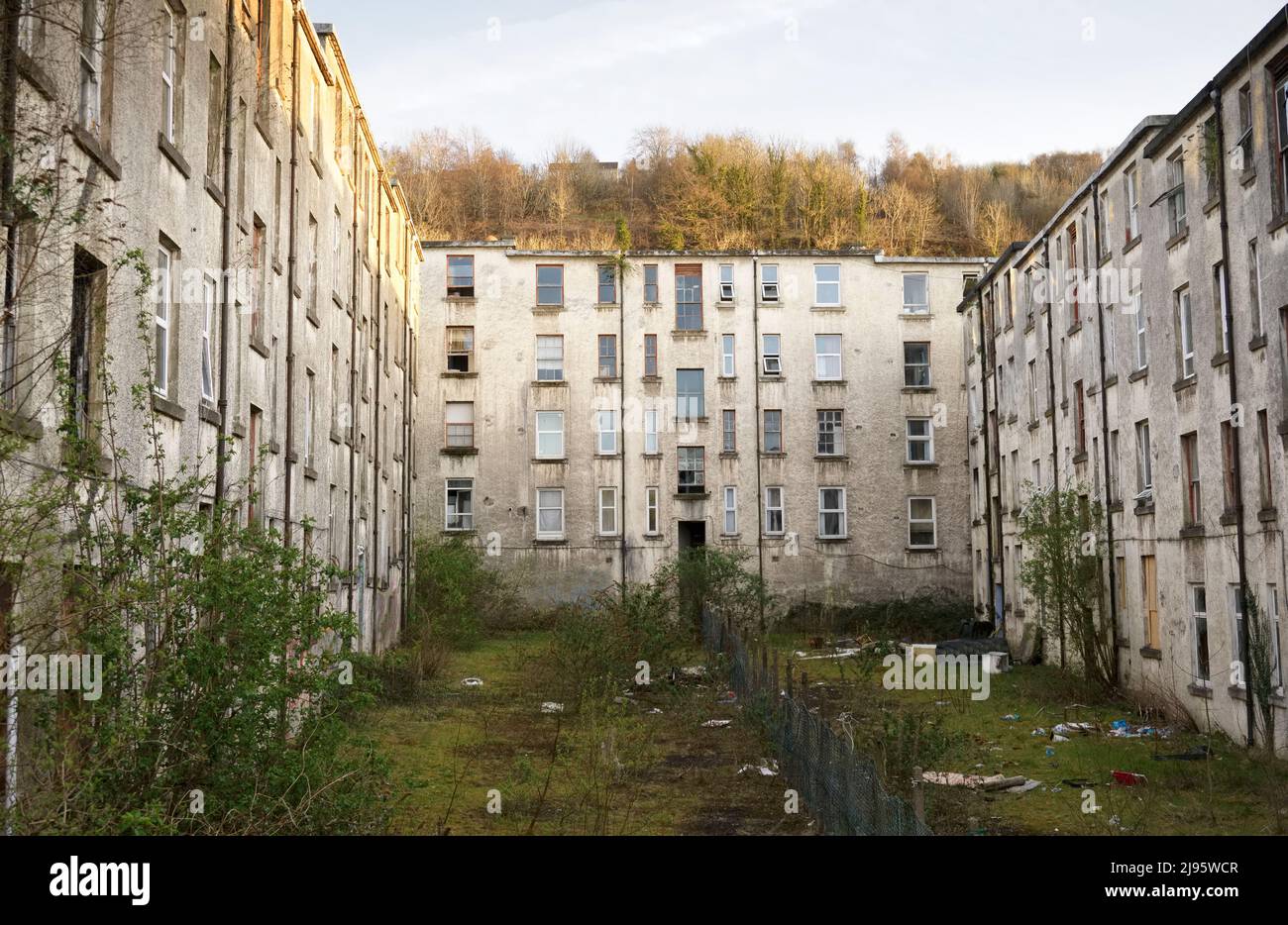 Derelict council house in poor housing estate slum with many social ...