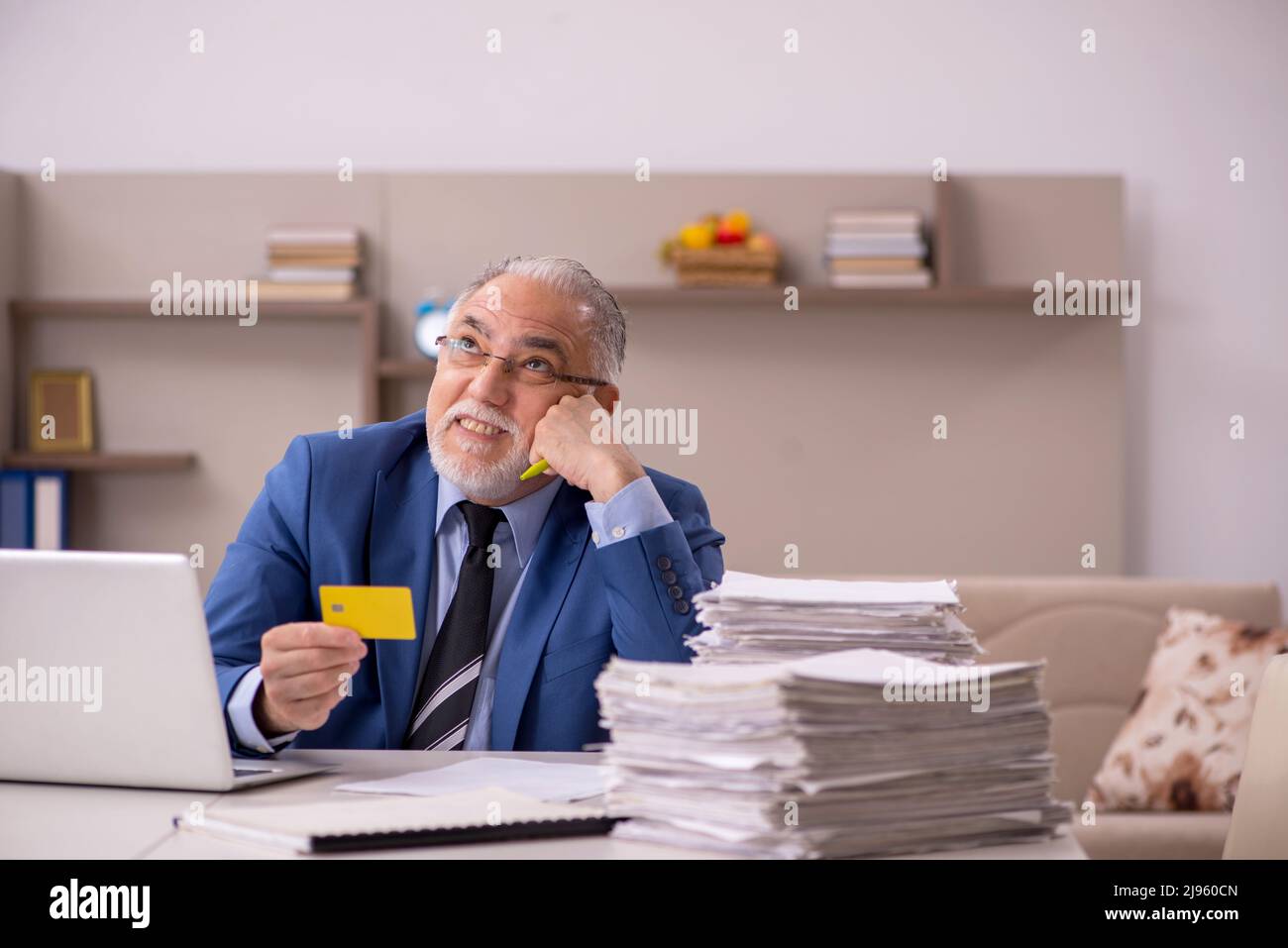 Old boss working from home during pandemic Stock Photo - Alamy