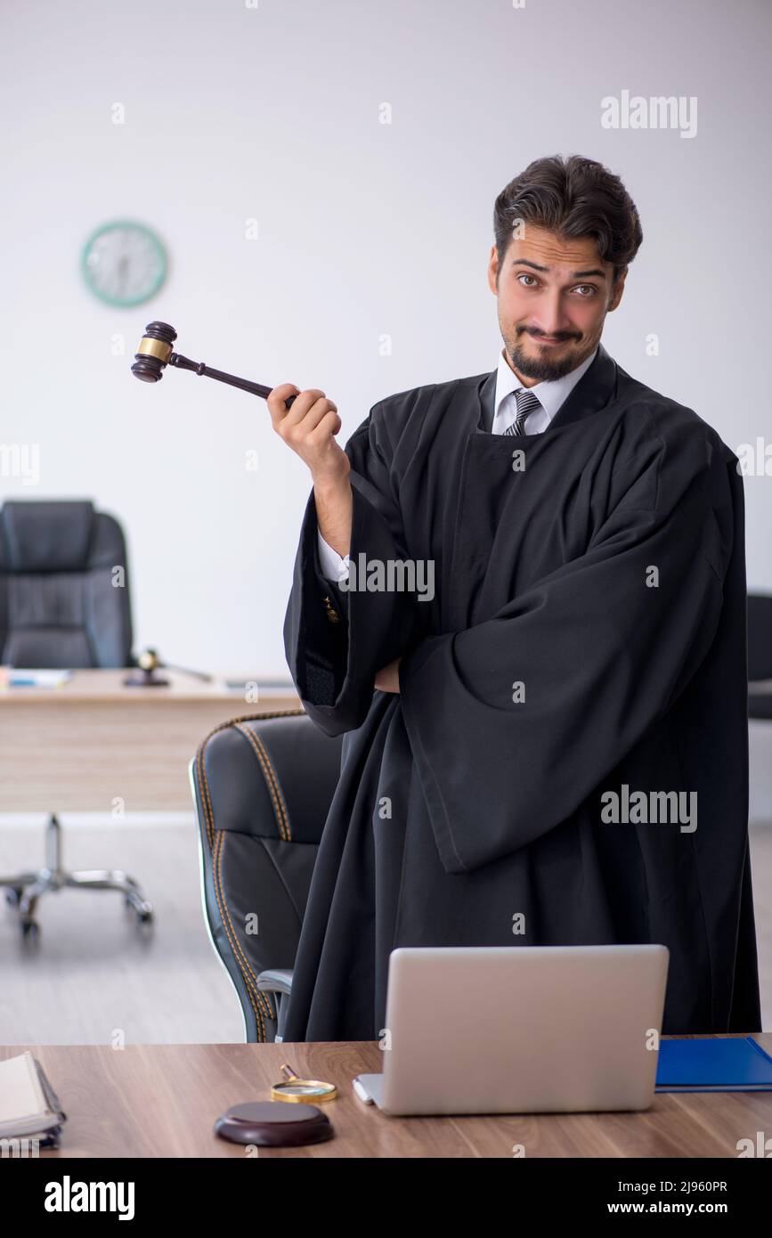 Young judge working in the courthouse Stock Photo - Alamy