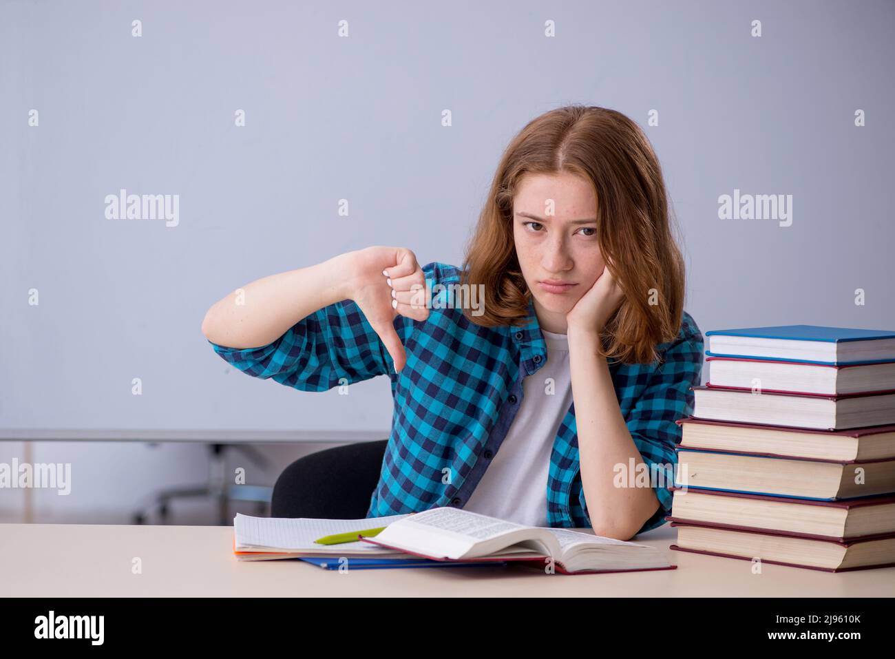 Young girl student preparing for exams in the classroom Stock Photo - Alamy