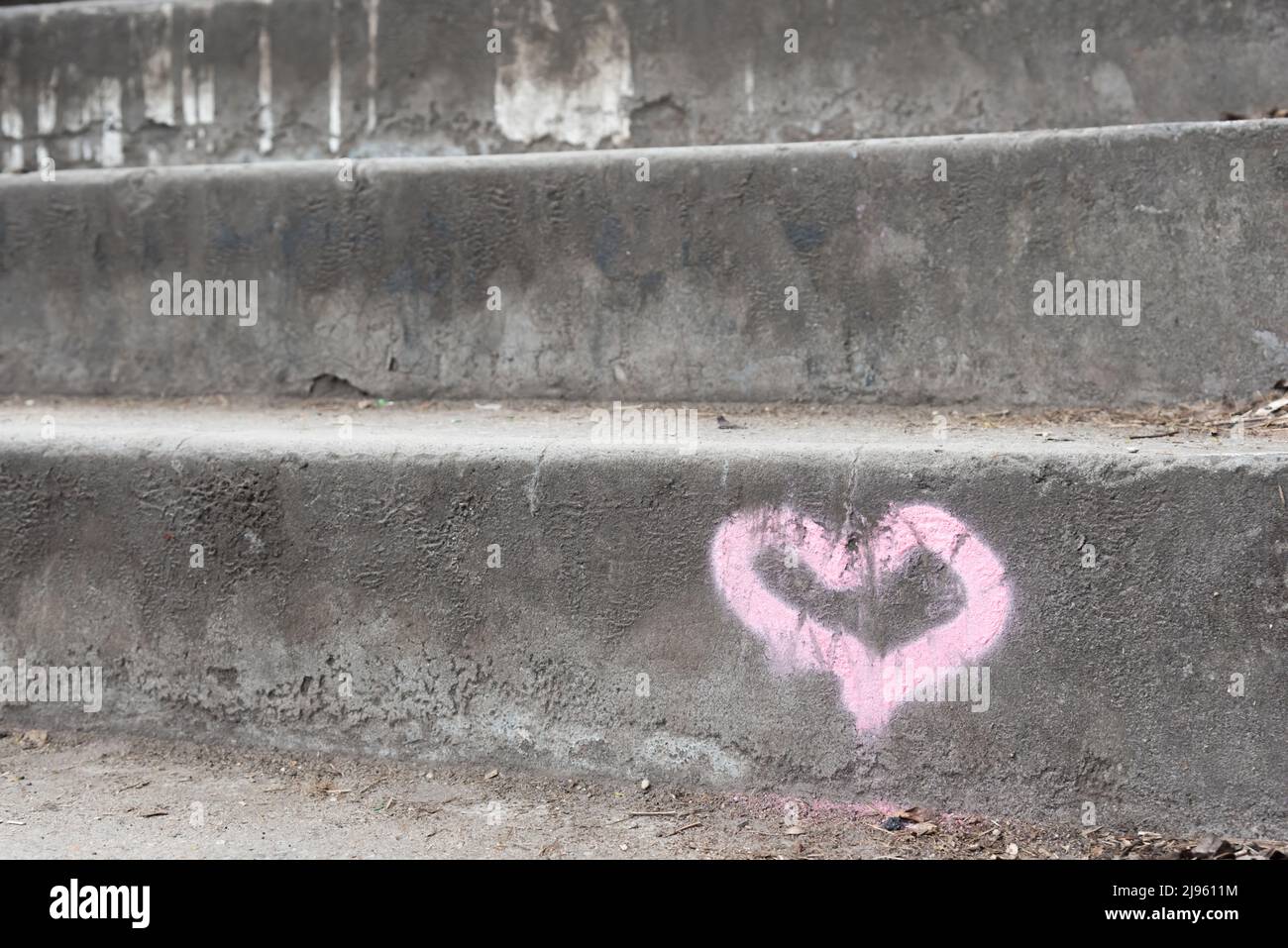 A heart symbol on a gray stair step Stock Photo - Alamy
