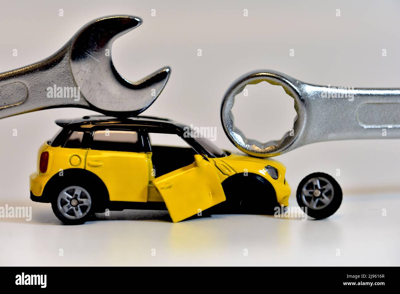 broken toy car with metal wrench tool Stock Photo - Alamy