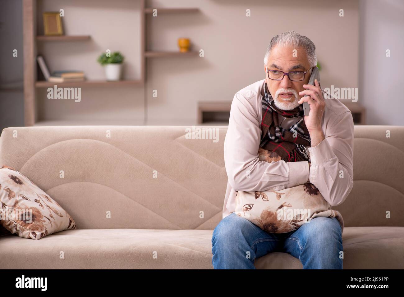Old man pensioner suffering at home Stock Photo - Alamy