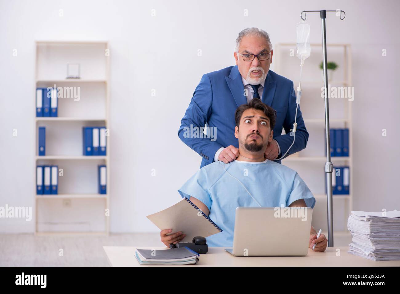 Young employee feeling bad at workplace Stock Photo - Alamy