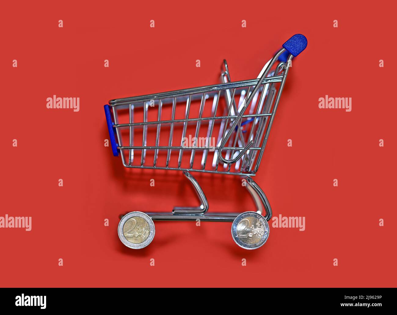 shopping cart with euro money wheels Stock Photo - Alamy