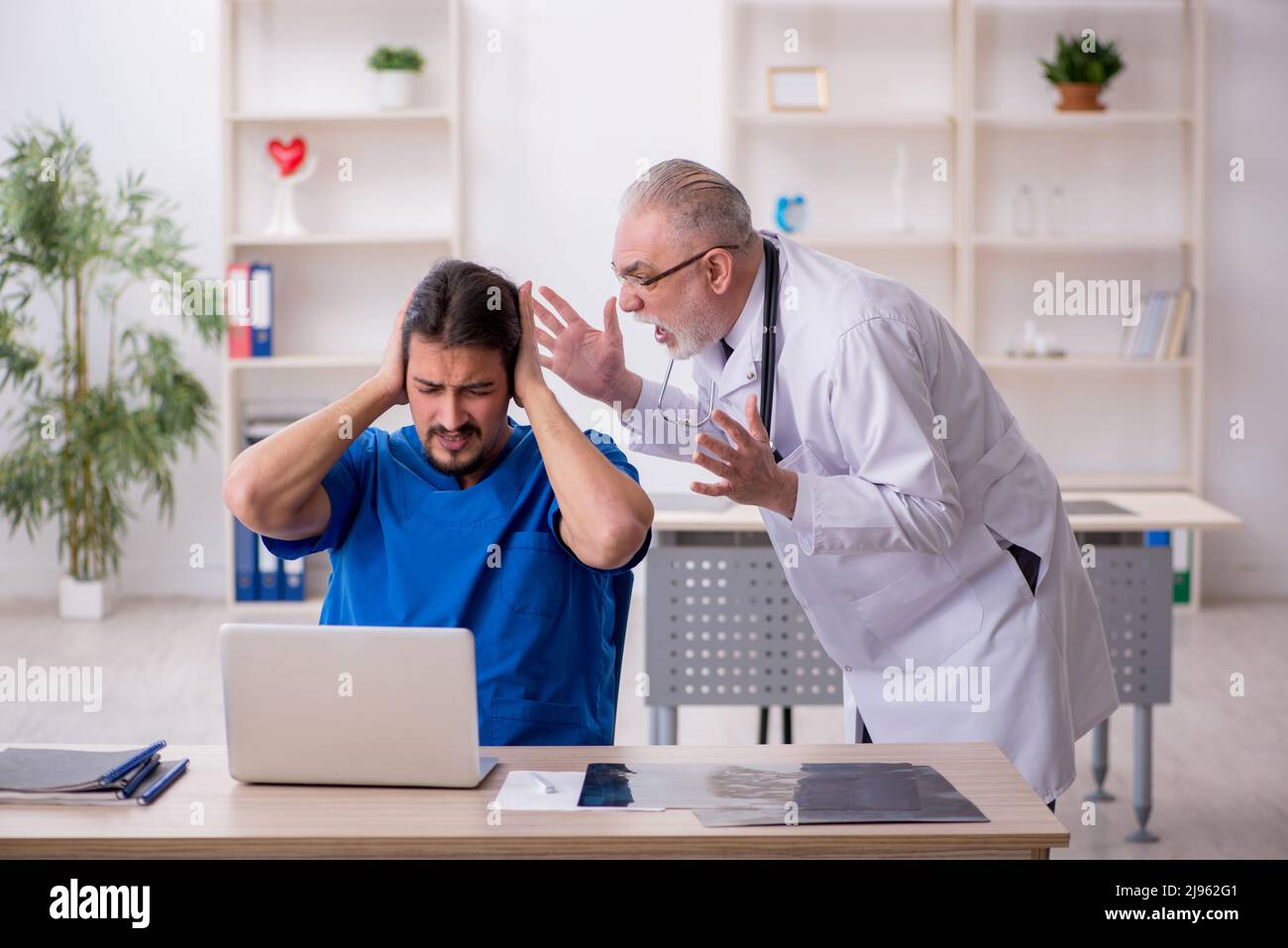 Two doctors working in the clinic Stock Photo - Alamy