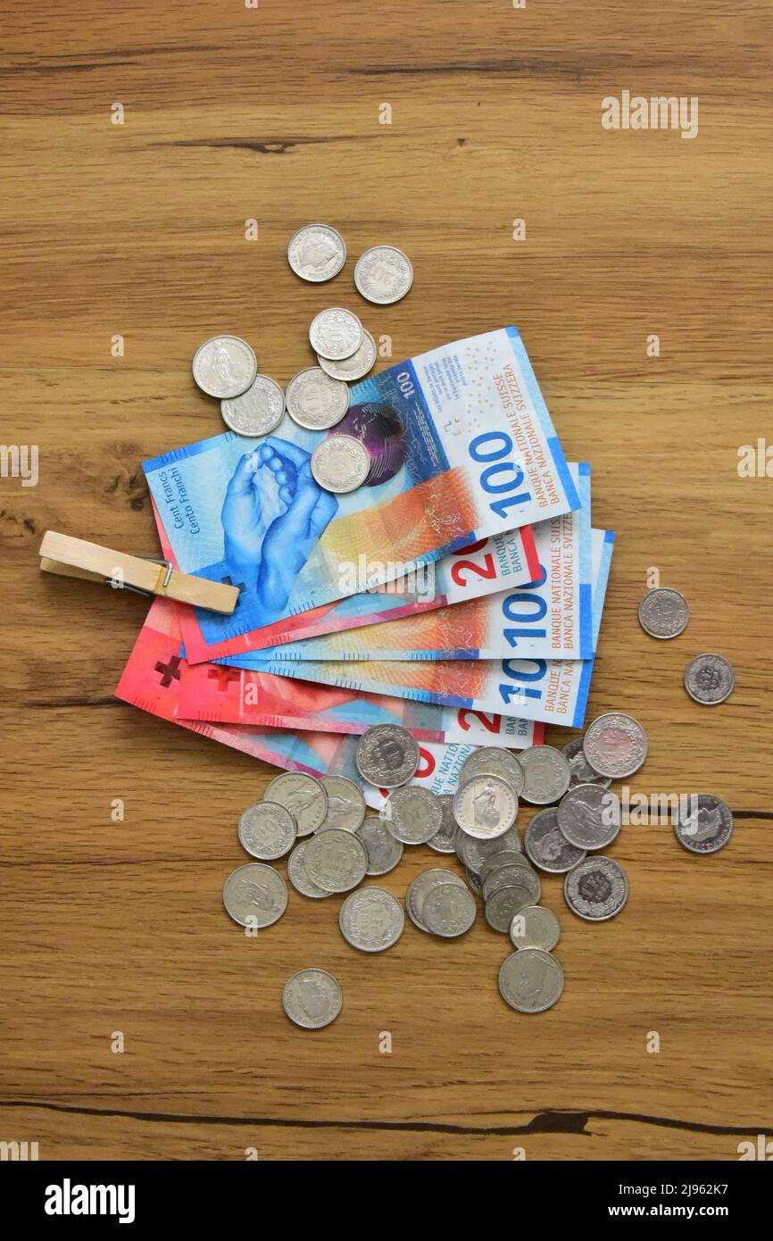 swiss money francs coins and banknotes Stock Photo - Alamy