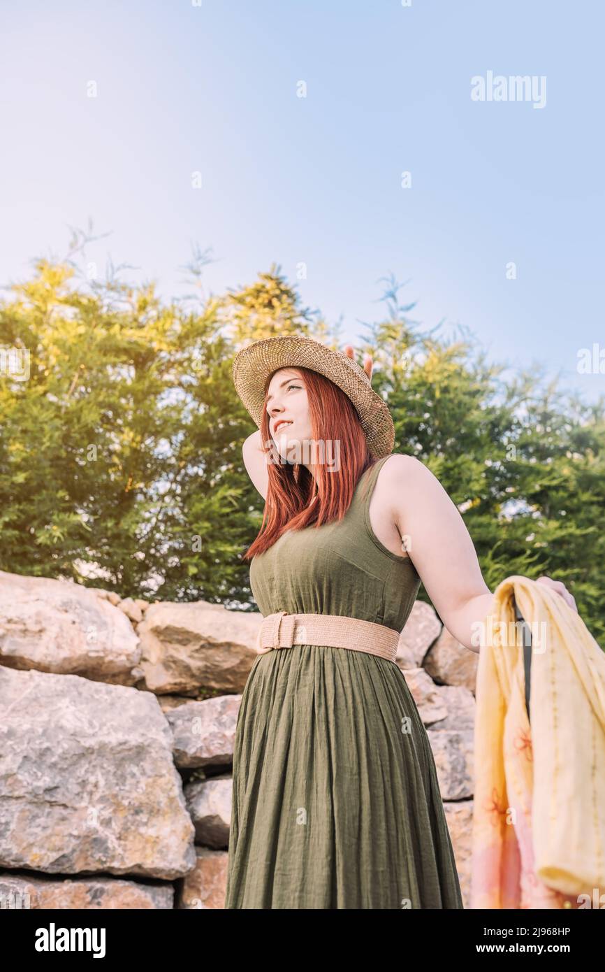 fearless and adventurous young girl, having fun on her summer holiday ...