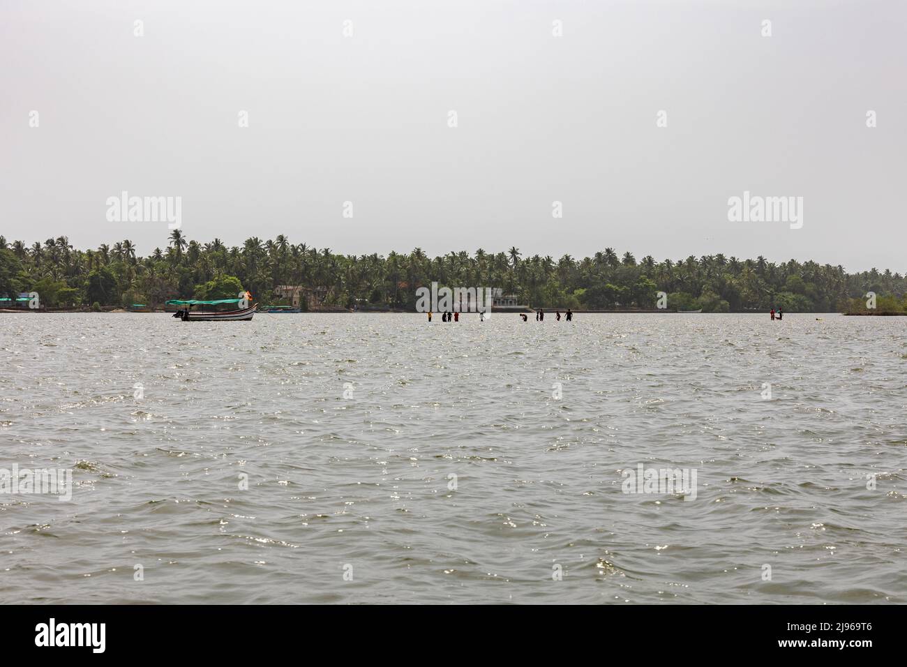Tourists enjoying in a shallow area of Karli River during summer season ...